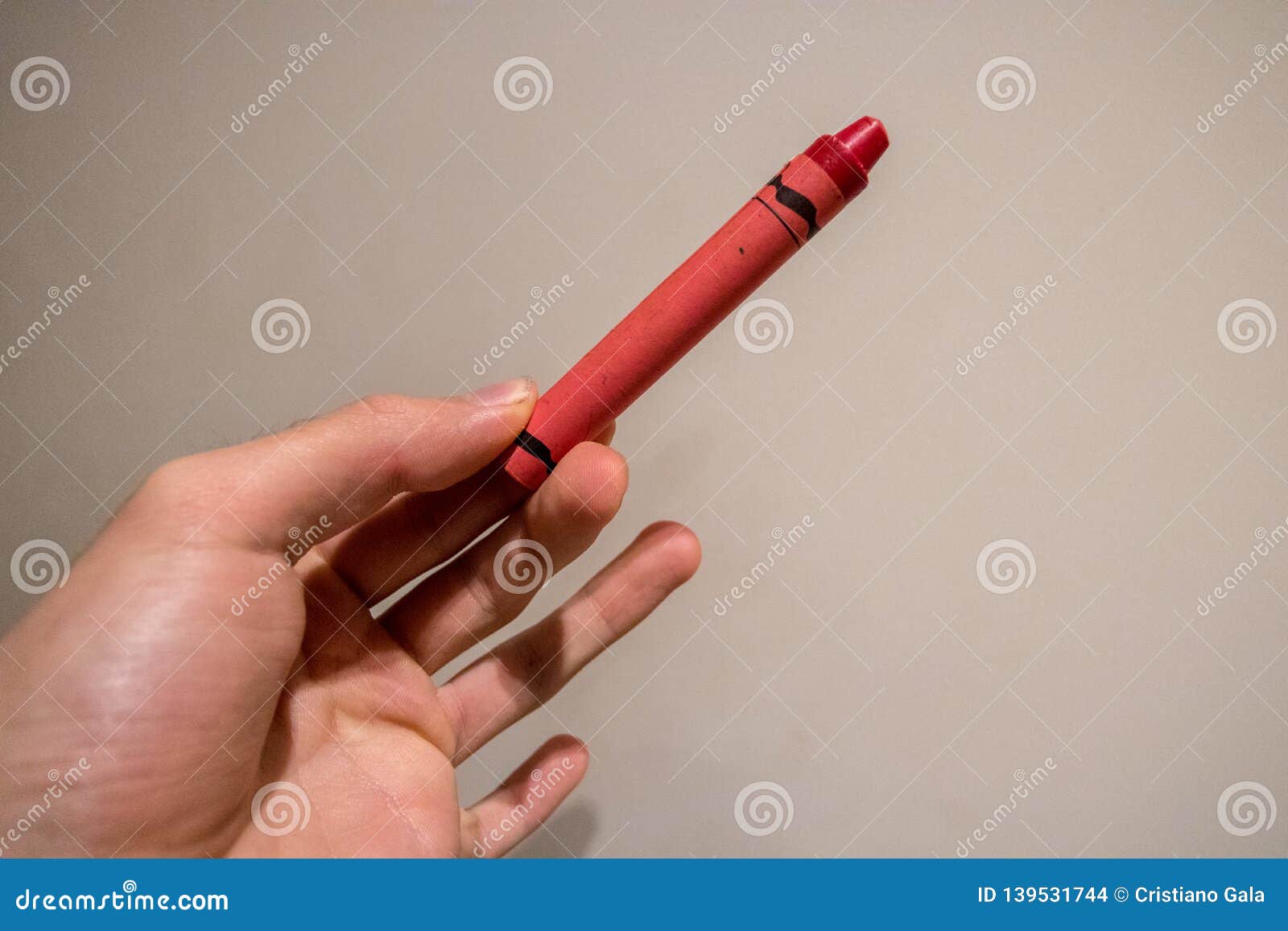 Red Crayon in Hand stock photo. Image of holding, drawing - 139531744