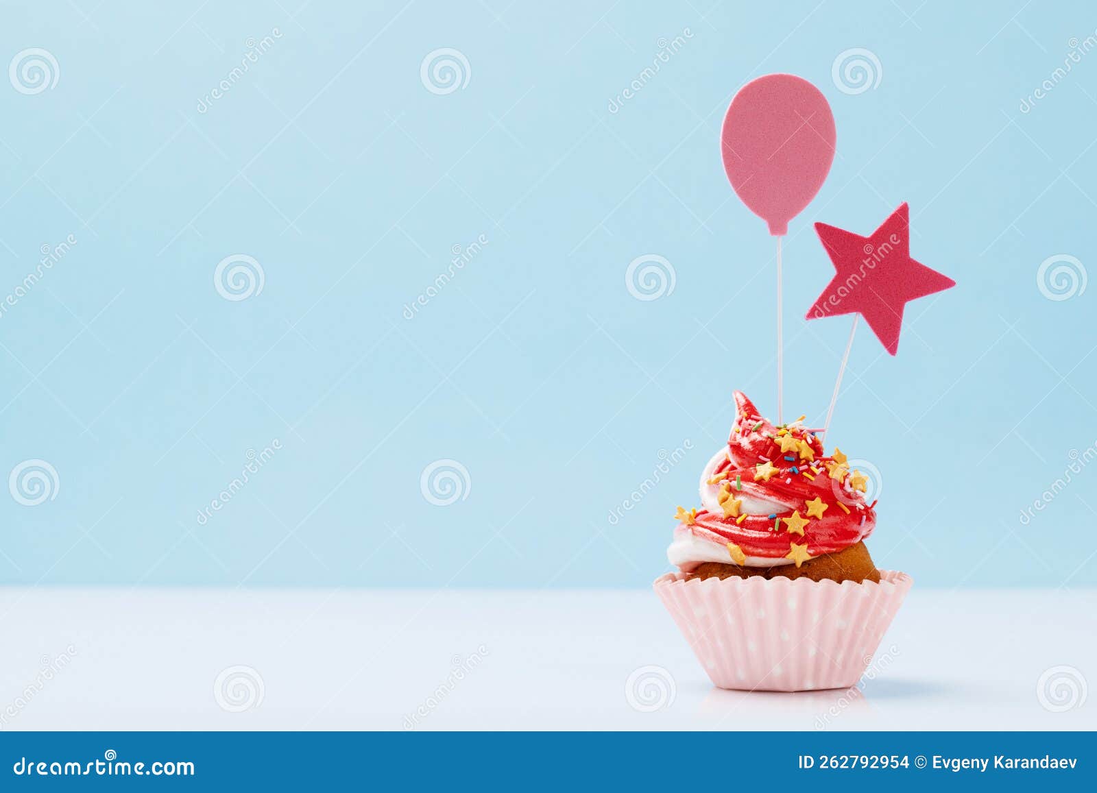 Red cream cupcake stock photo. Image of icing, frosted - 262792954