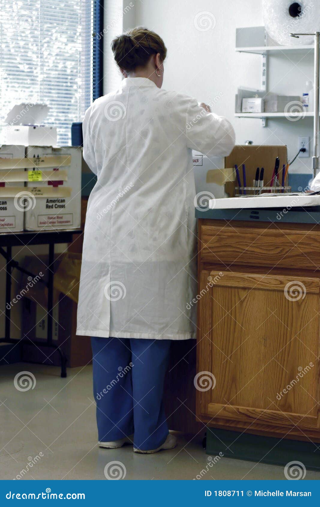 Red cross worker in lab editorial photo. Image of cells - 1808711