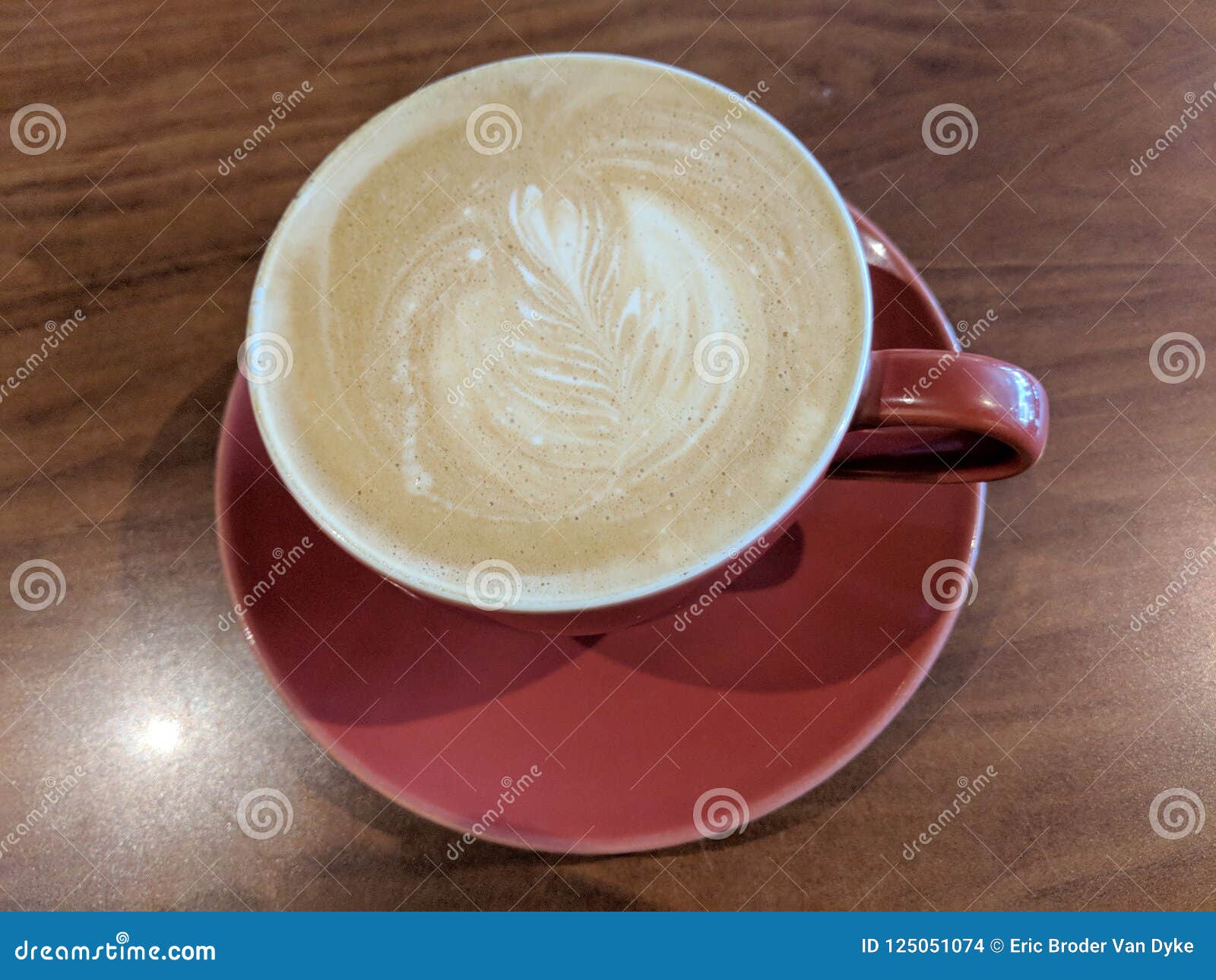 Red Cup of Cappuccino on Saucer with a Leaf Pattern in Foam Stock Photo ...