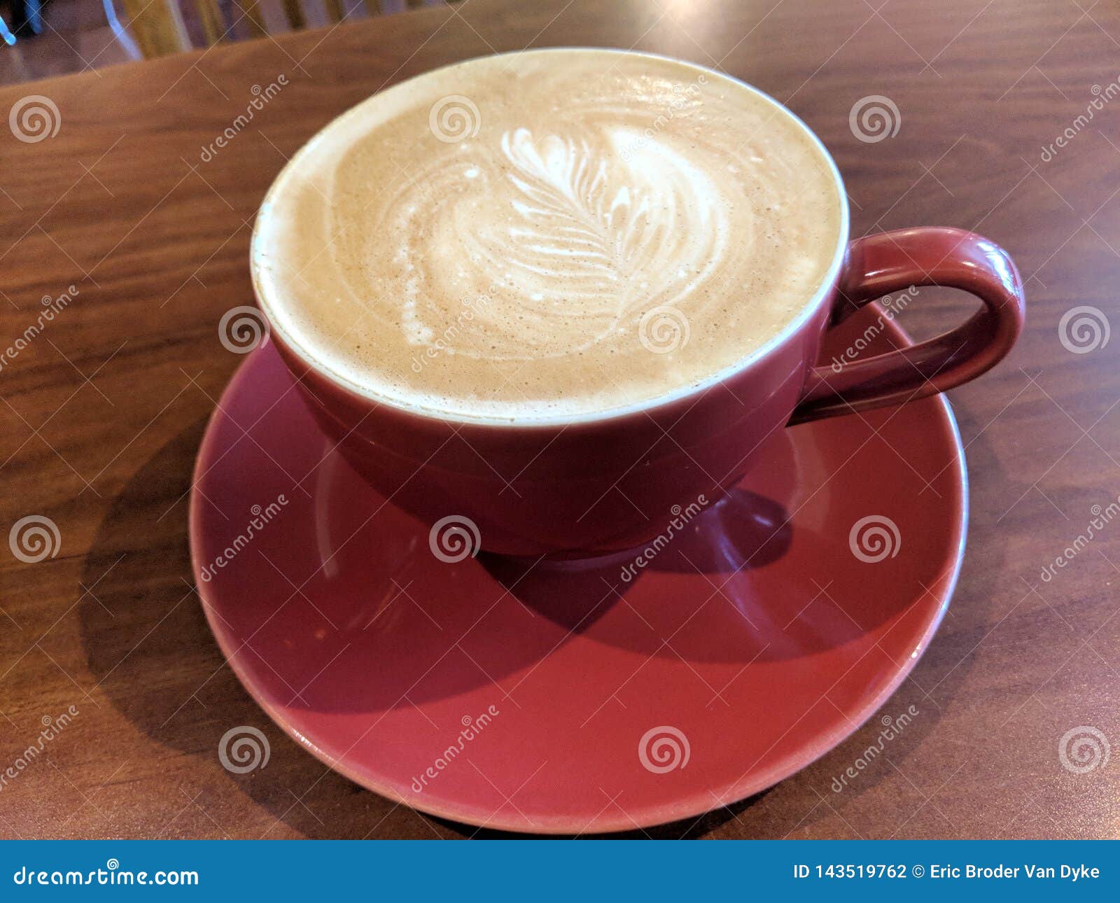 Red Cup of Cappuccino on Saucer with a Leaf Pattern in Foam Stock Photo ...