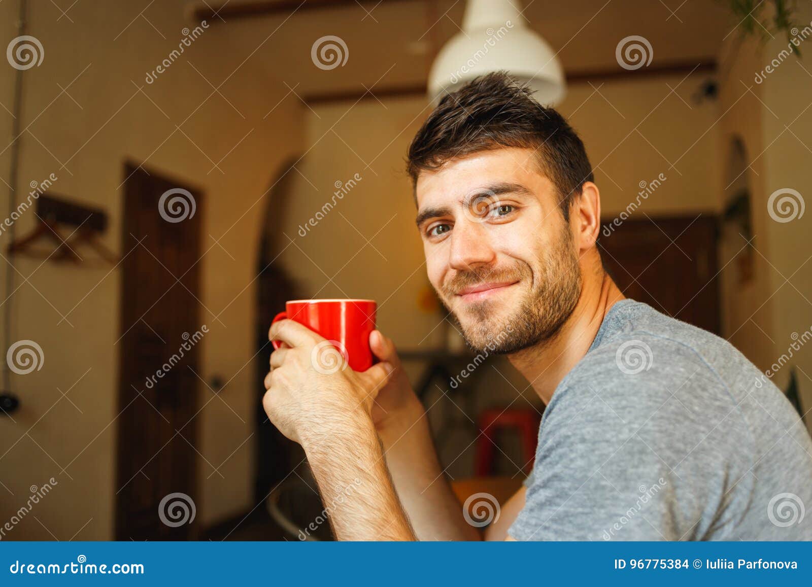 Red Cup in the Hands of a Smiling Handsome Stock Photo - Image of ...