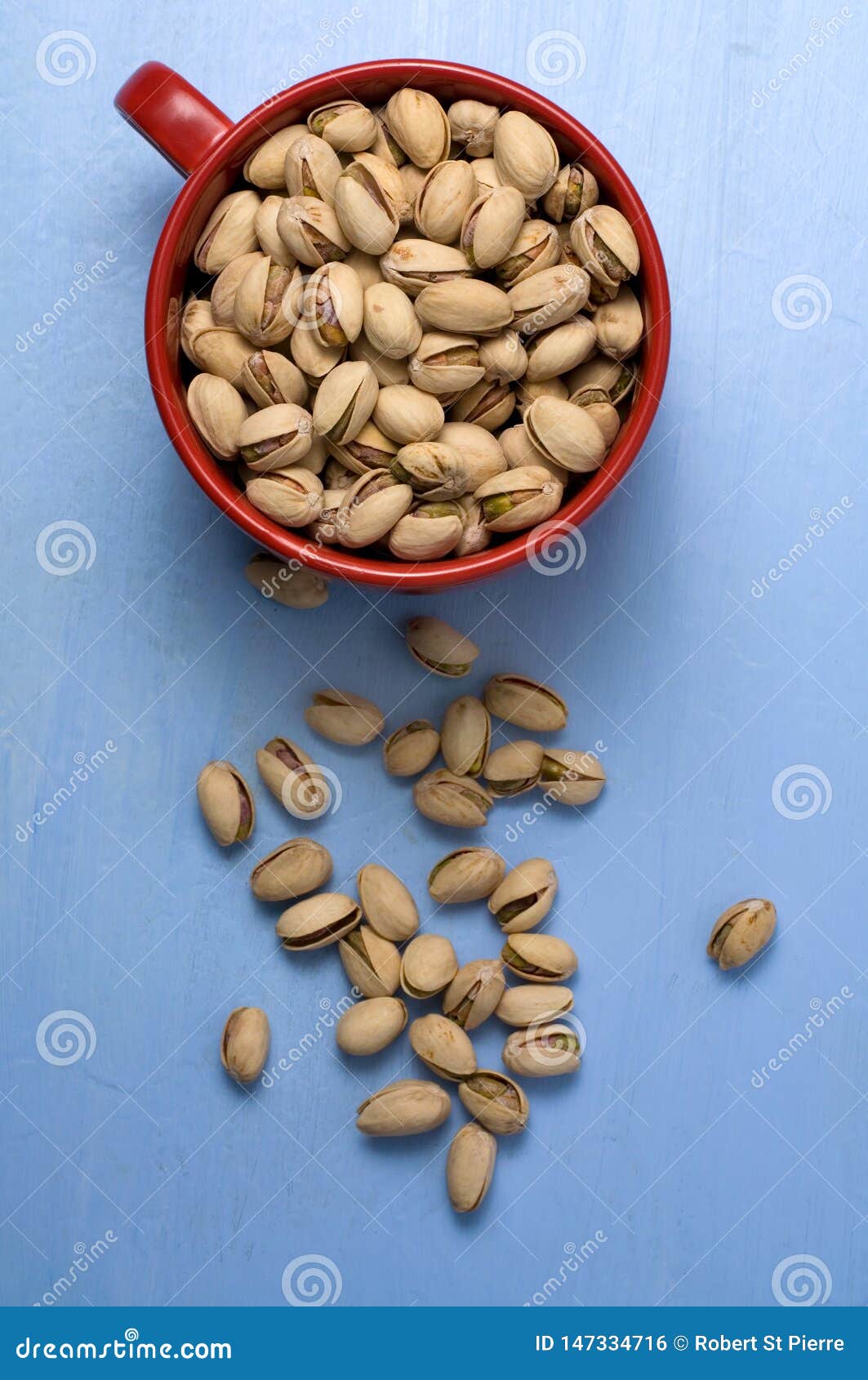 Red Cup of Pistachios on Blue Background Stock Photo - Image of health ...