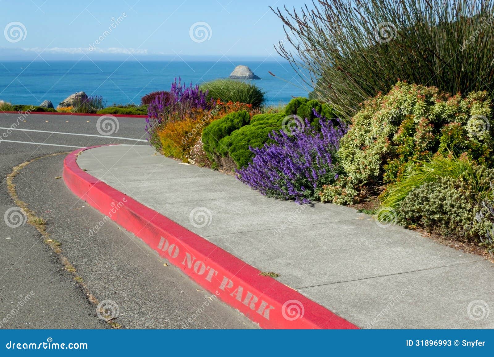 A Curb Sign Points To A Stip Mall Across Road Royalty-Free Stock ...