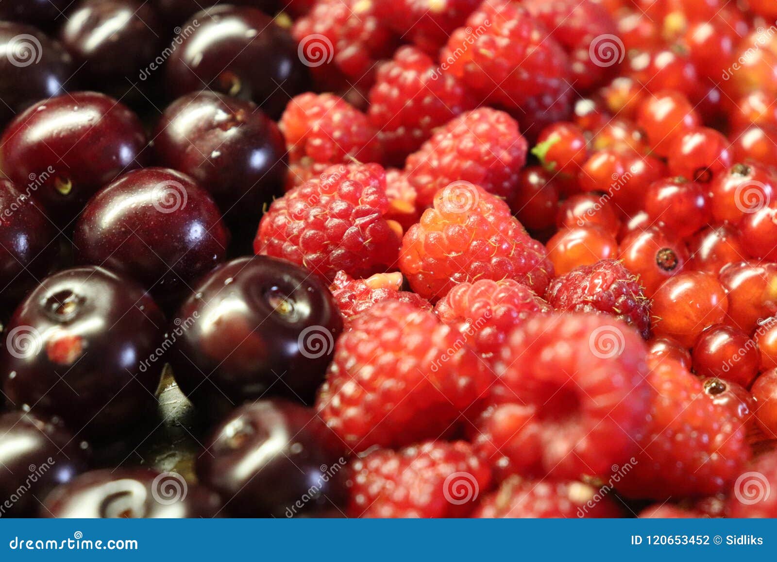 Photo of Cherry, Red Currant and Raspberries on Wooden Table Stock ...