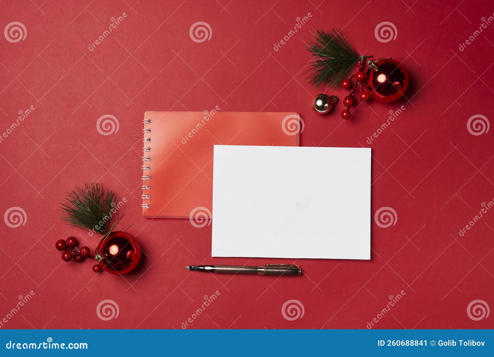 A Red Desk with a Notebook and Christmas Decorations Stock Image ...