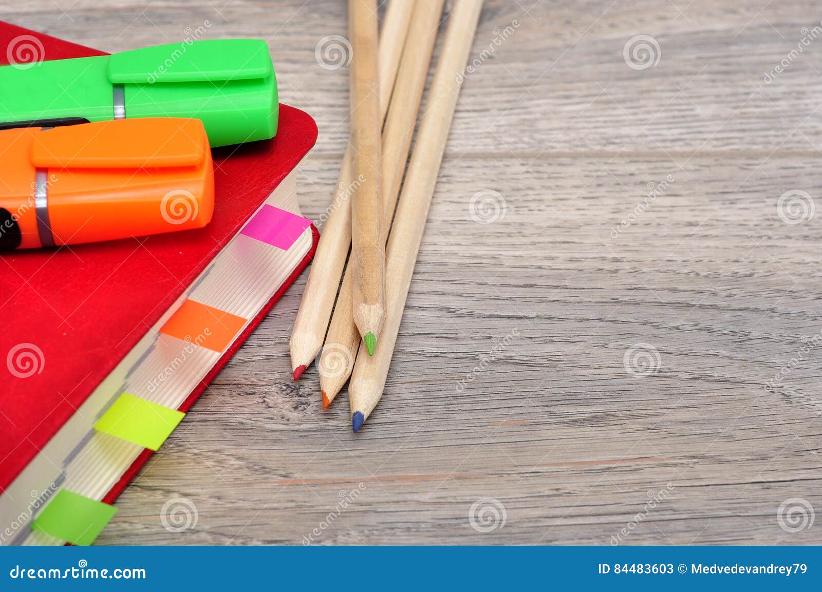 Red Diary Notebook and Colored Pencils, Marker on the Table Wood Stock ...