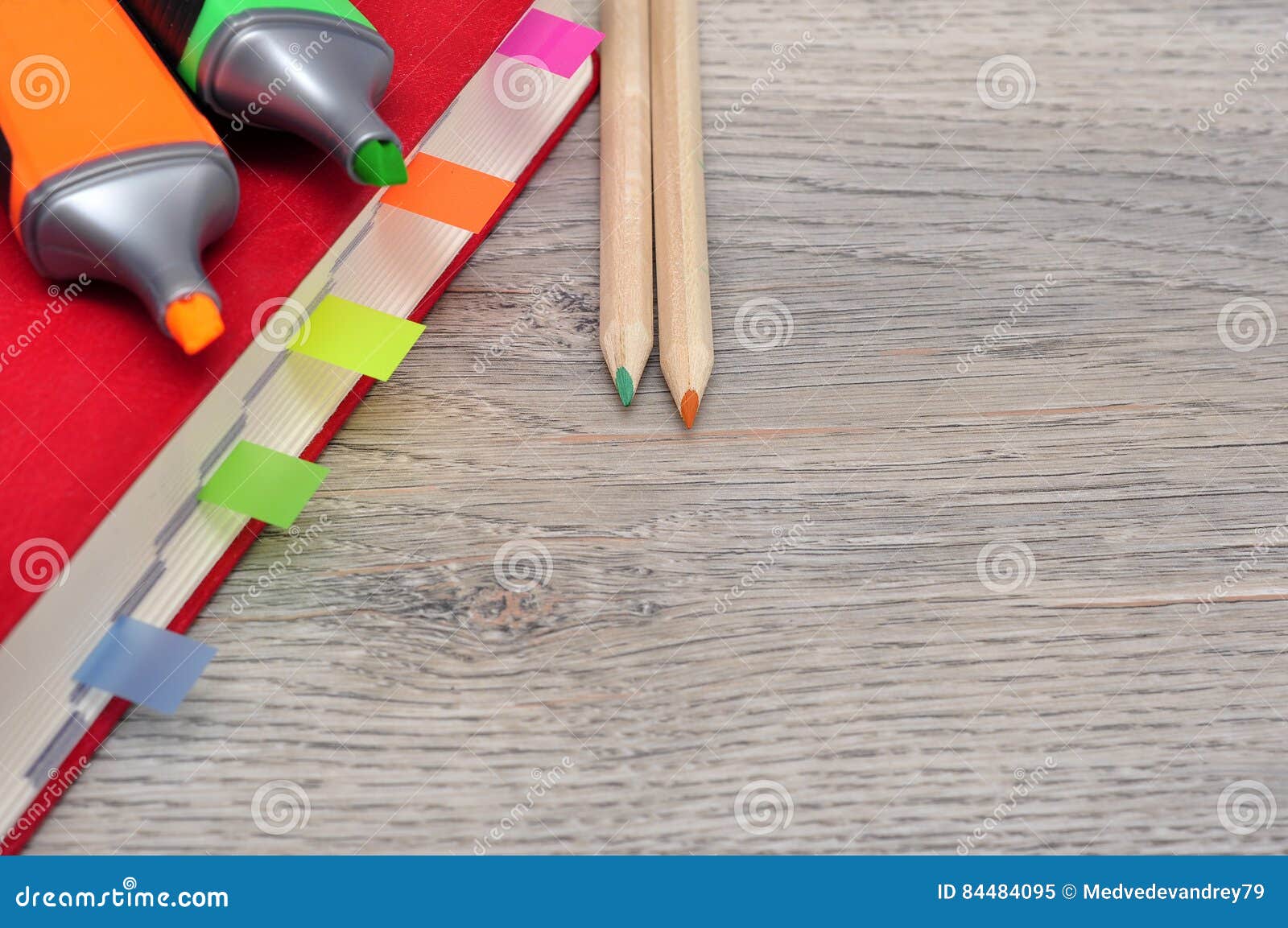 Red Diary Notebook and Colored Pencils, Marker on the Table Wood Stock ...
