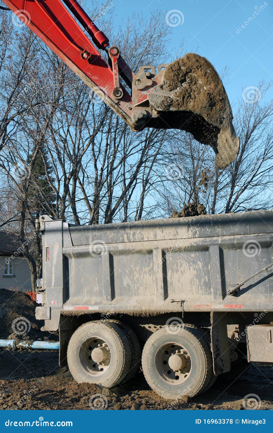 Red Digger Dumping Dirt Vertical Stock Photo - Image of industry ...