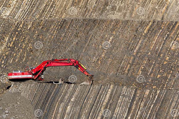 Red digger in stone-pit stock image. Image of limestone - 78780177