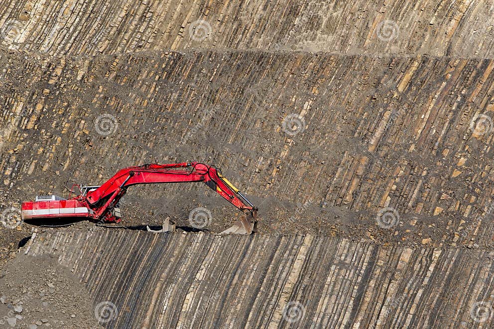 Red digger in stone-pit stock image. Image of limestone - 78780177