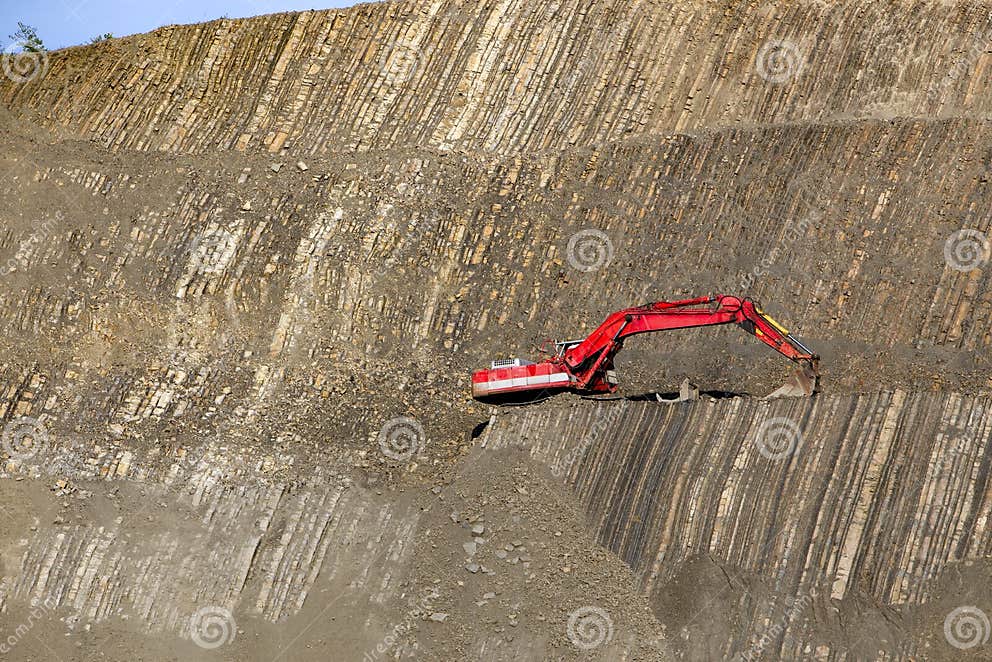 Red digger in stone-pit stock image. Image of vehicle - 78780297