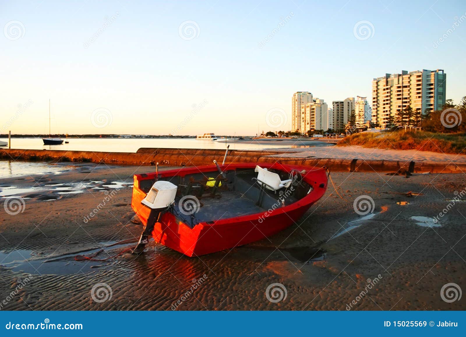 Red Dinghy stock image. Image of pipes, broadwater, clouds - 15025569