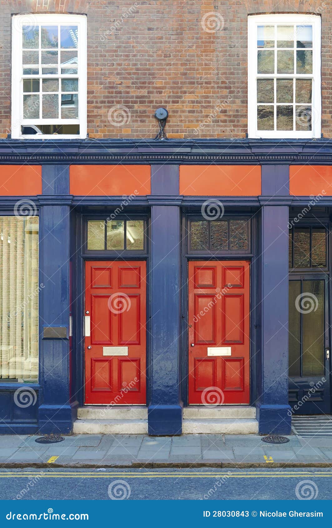 Red doors on building stock image. Image of sidewalk - 28030843