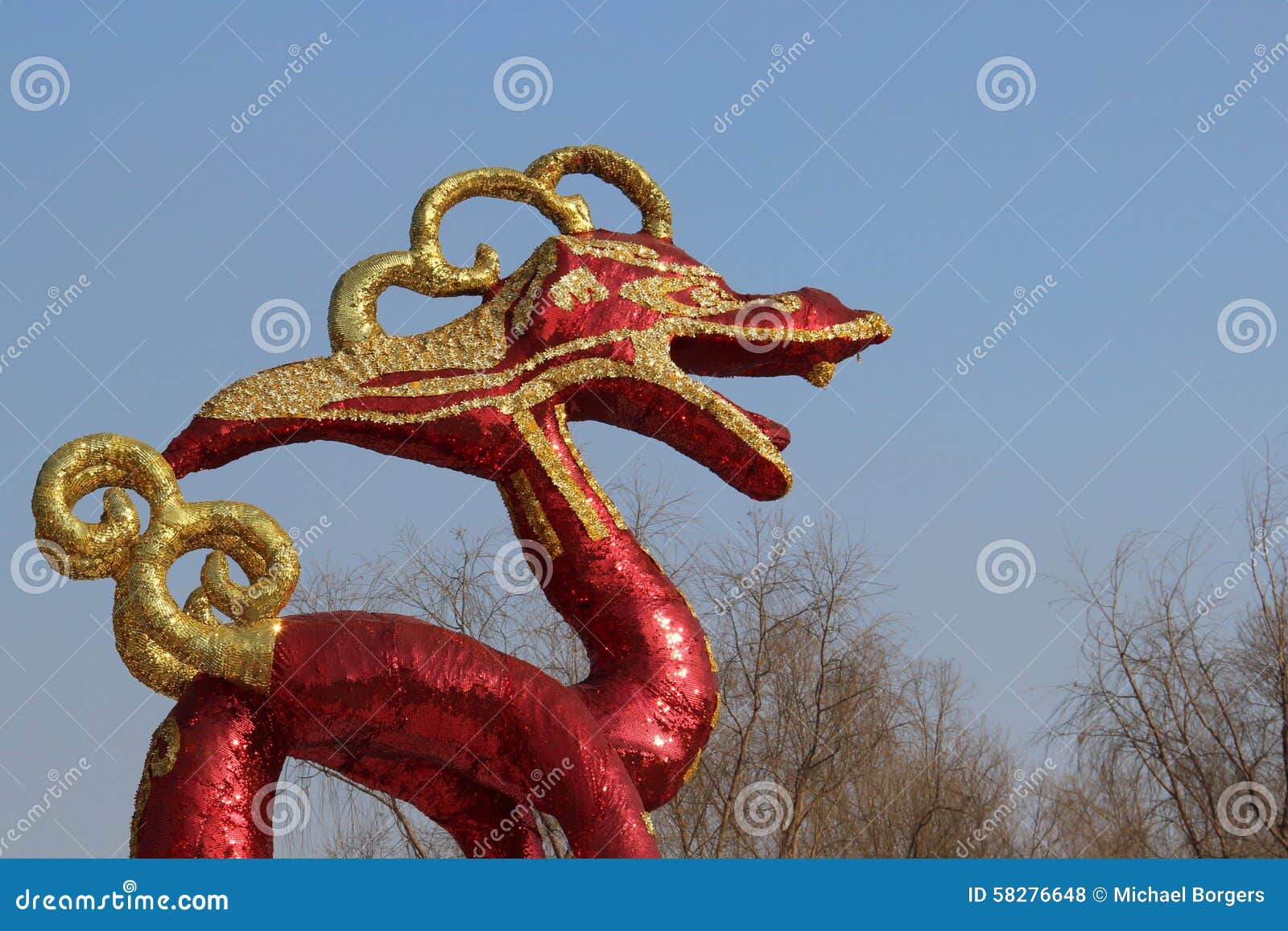 Red Dragon in Front of Blue Sky Stock Photo - Image of blue, trees ...