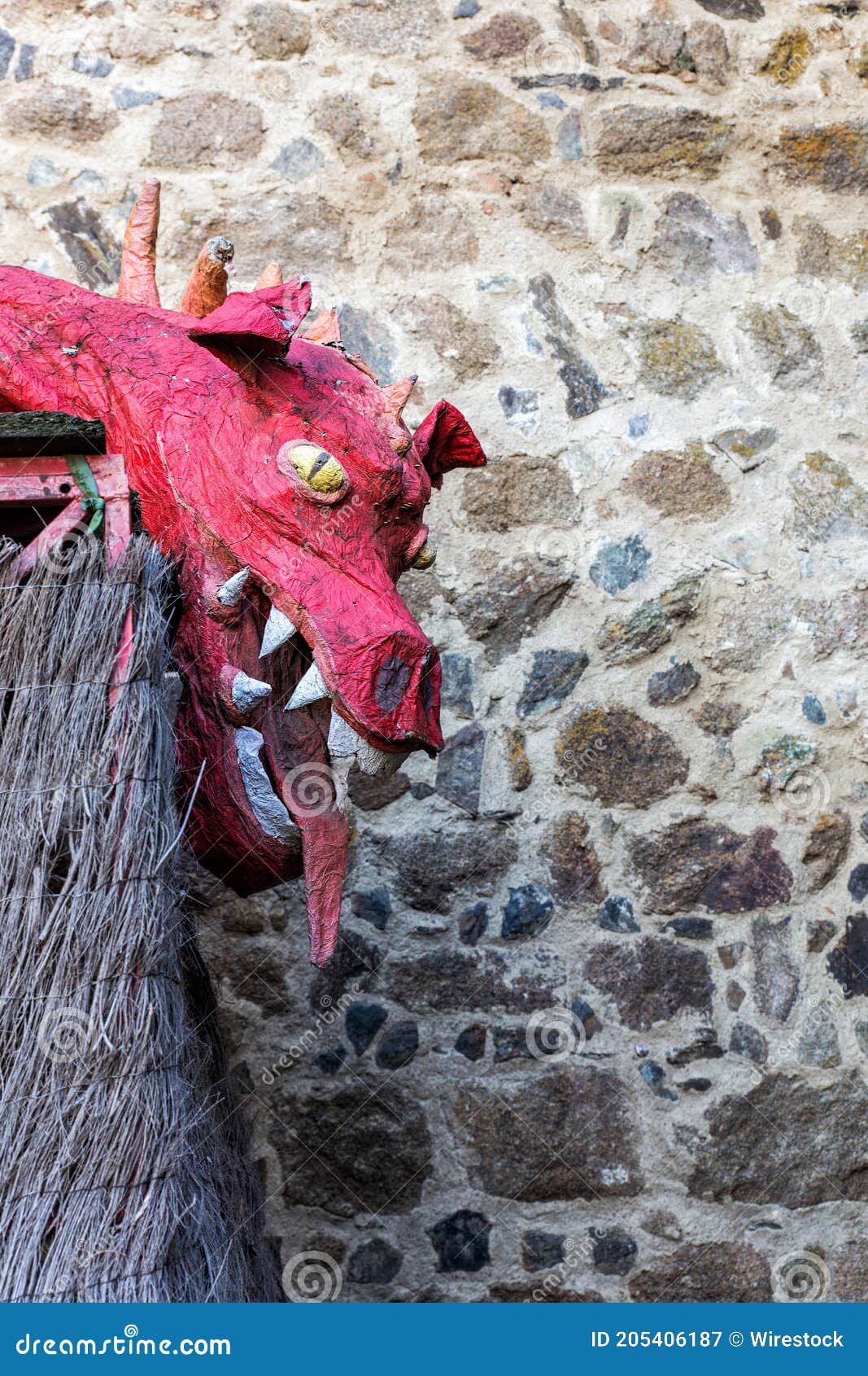 Red Dragon Statue in Front of a Stone Wall Stock Image - Image of ...