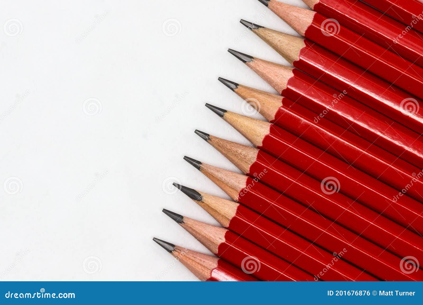 Row of Sharp Red Drawing Pencils on a White Background with Copy Space ...