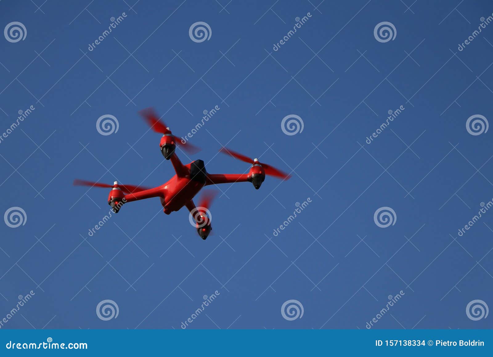 Red Drone on a Blue Background Stock Photo - Image of flying, galassi ...