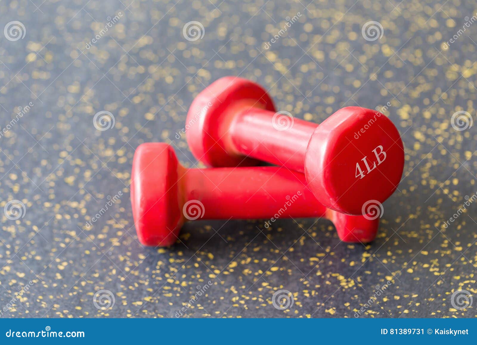 Red dumbbell on the floor. stock image. Image of iron - 81389731