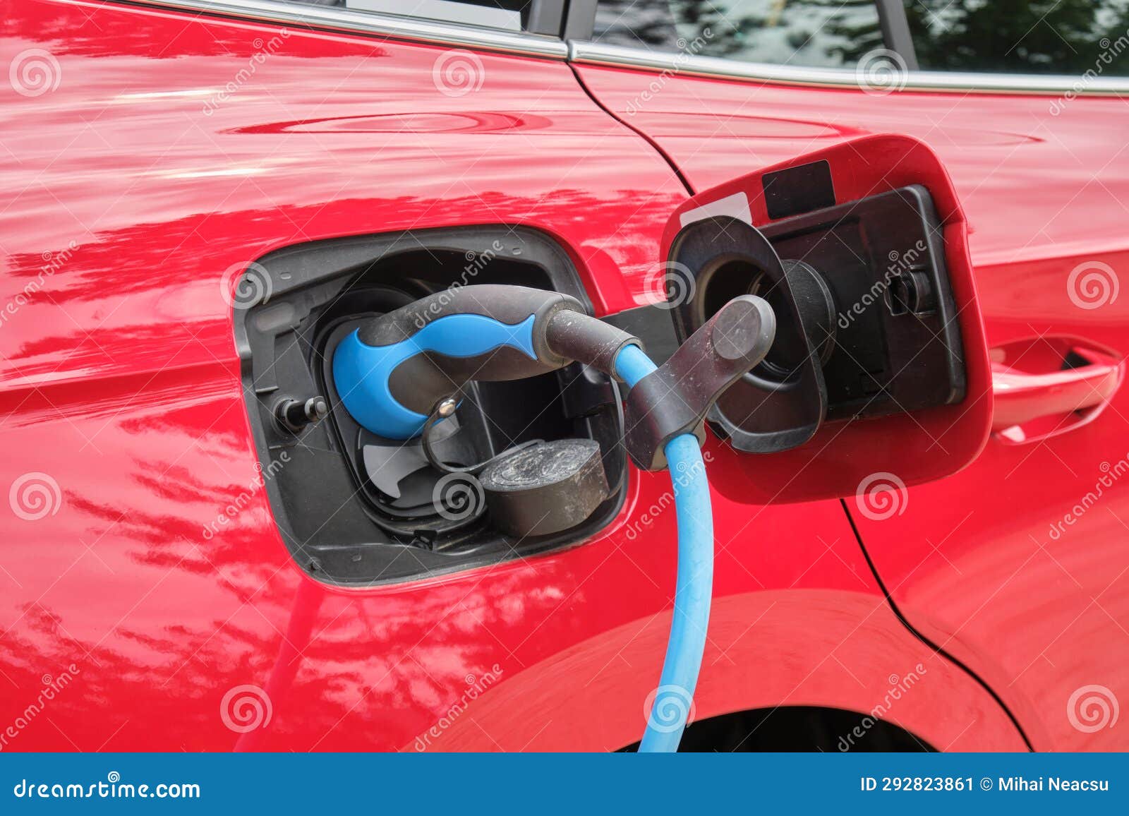 Red Electric Car Charging - Close Up of Charger Stock Image - Image of ...