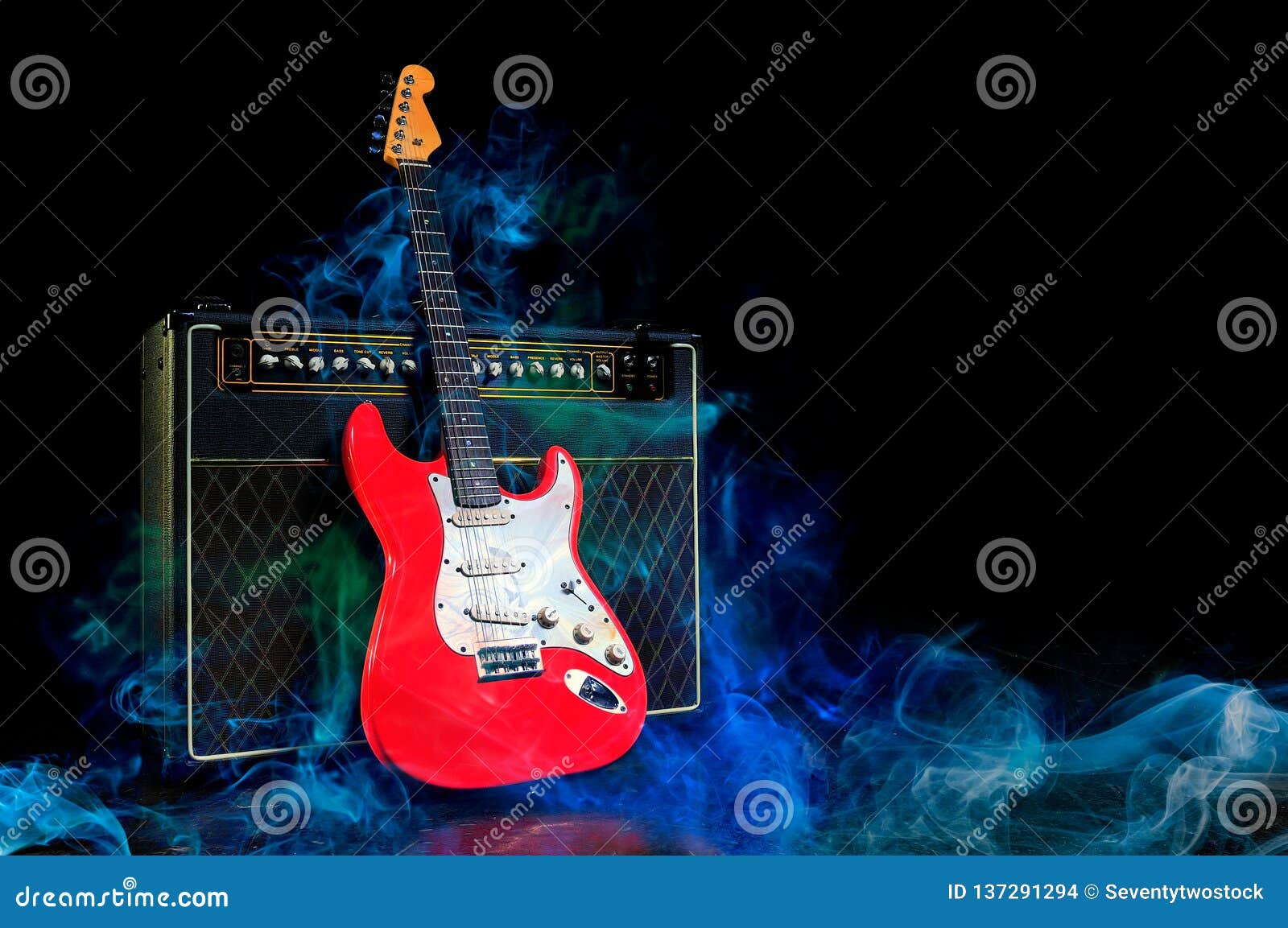 Red Electric Guitar and Amplifier Surrounded by Smoke Stock Photo ...