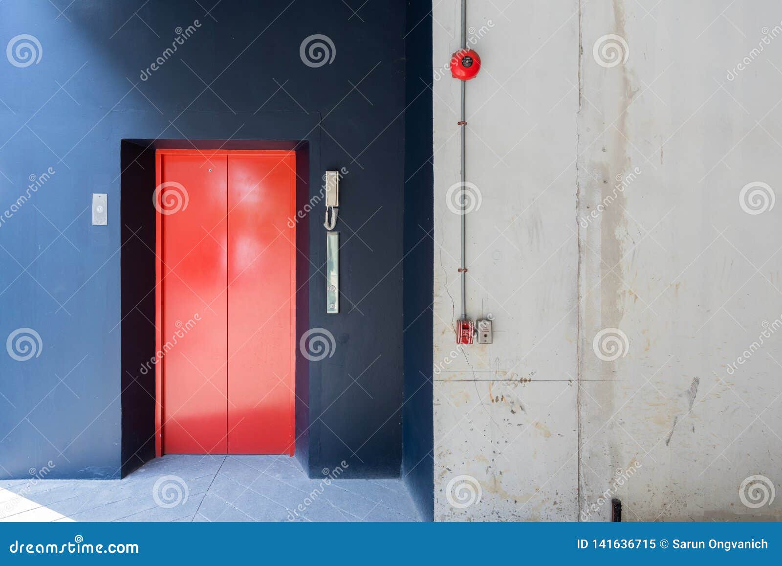 Red Elevator and Black Wall with Fire Alarm, Telephone Stock Image ...