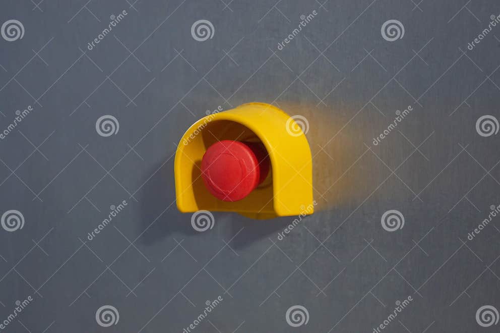 Red emergency stop button stock image. Image of wall - 214339085