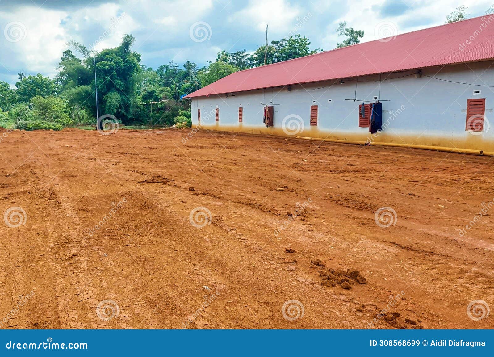 Red Empty Land in Front of a White School Building Stock Image - Image ...