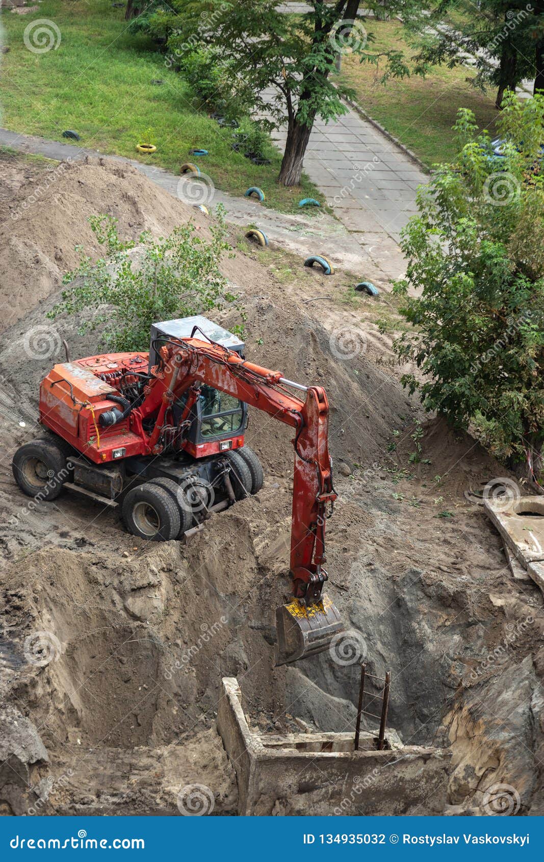 Red Excavator Digging a Pit Stock Photo - Image of loader, mover: 134935032