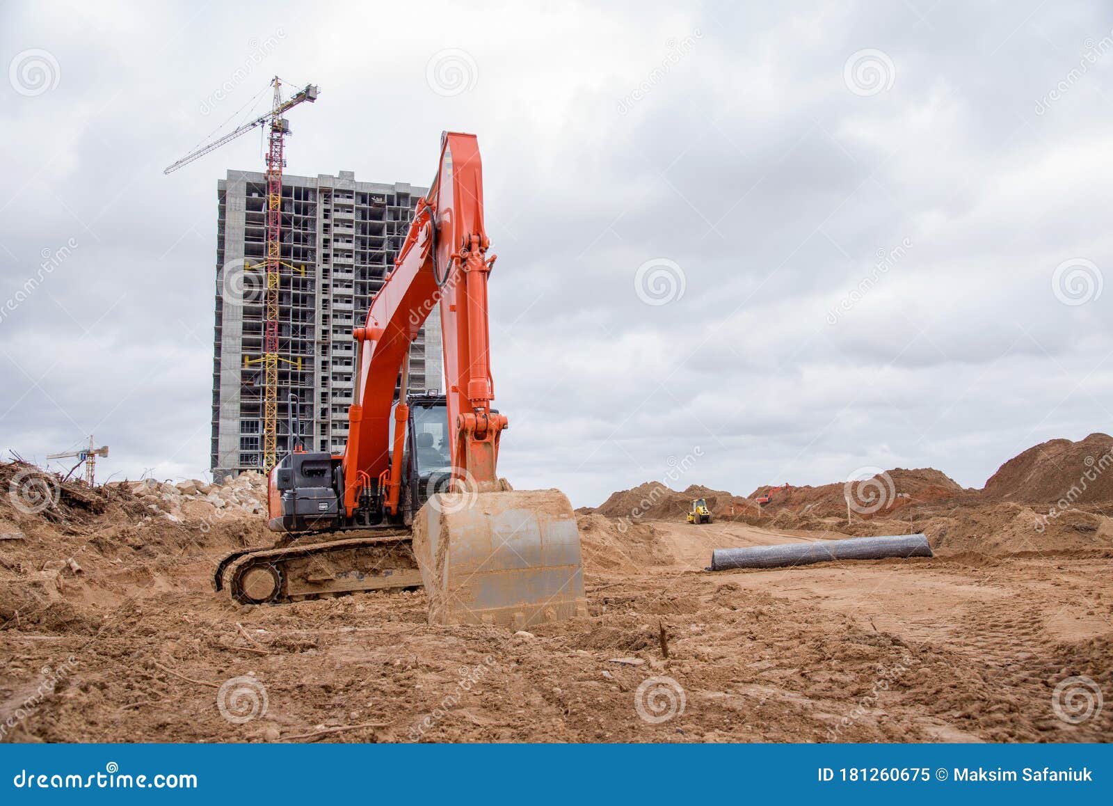 Red Excavator during Earthmoving at Construction Site. Backhoe Dig ...