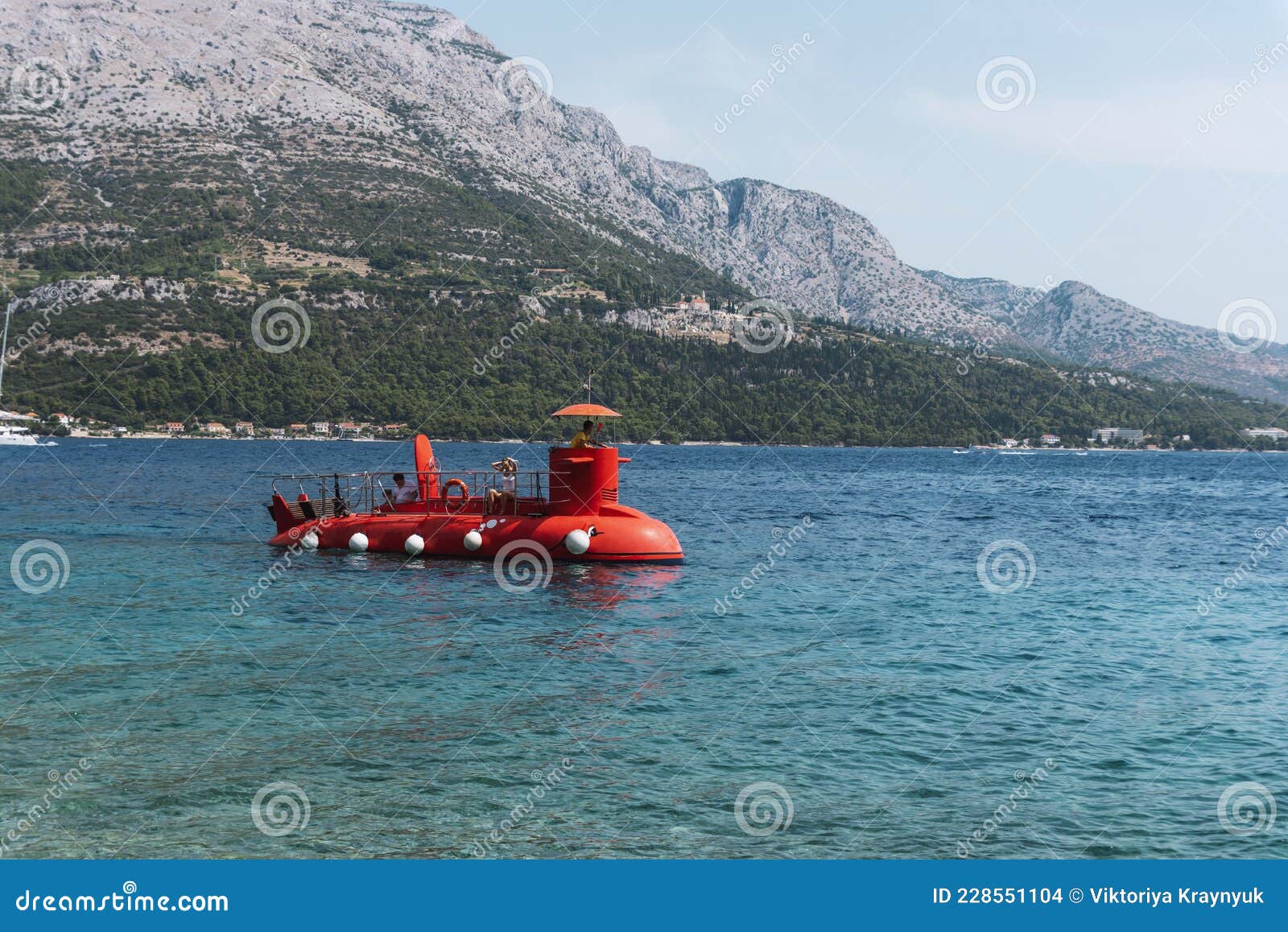 Red Excursion Submarine Sails Along the Coast with Mountains Editorial ...