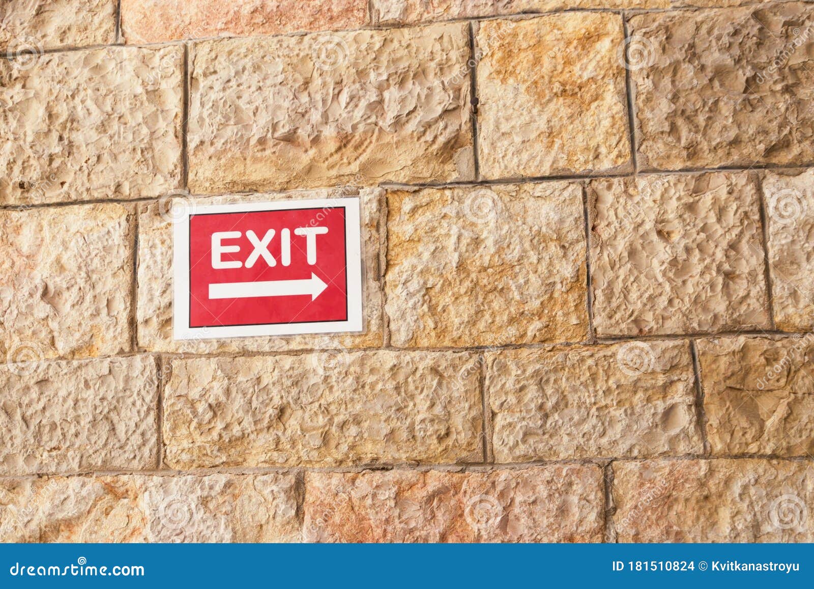 Red Exit Sign on Sandstone Textured Wall Background Stock Photo - Image ...