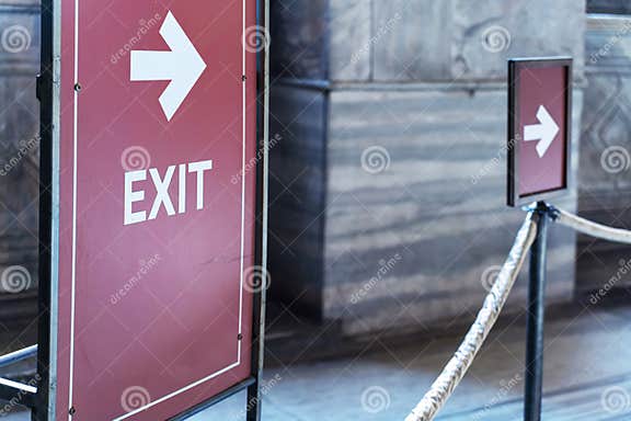 Red Exit Signs with White Arrows Provide Clear Direction for Safe and ...