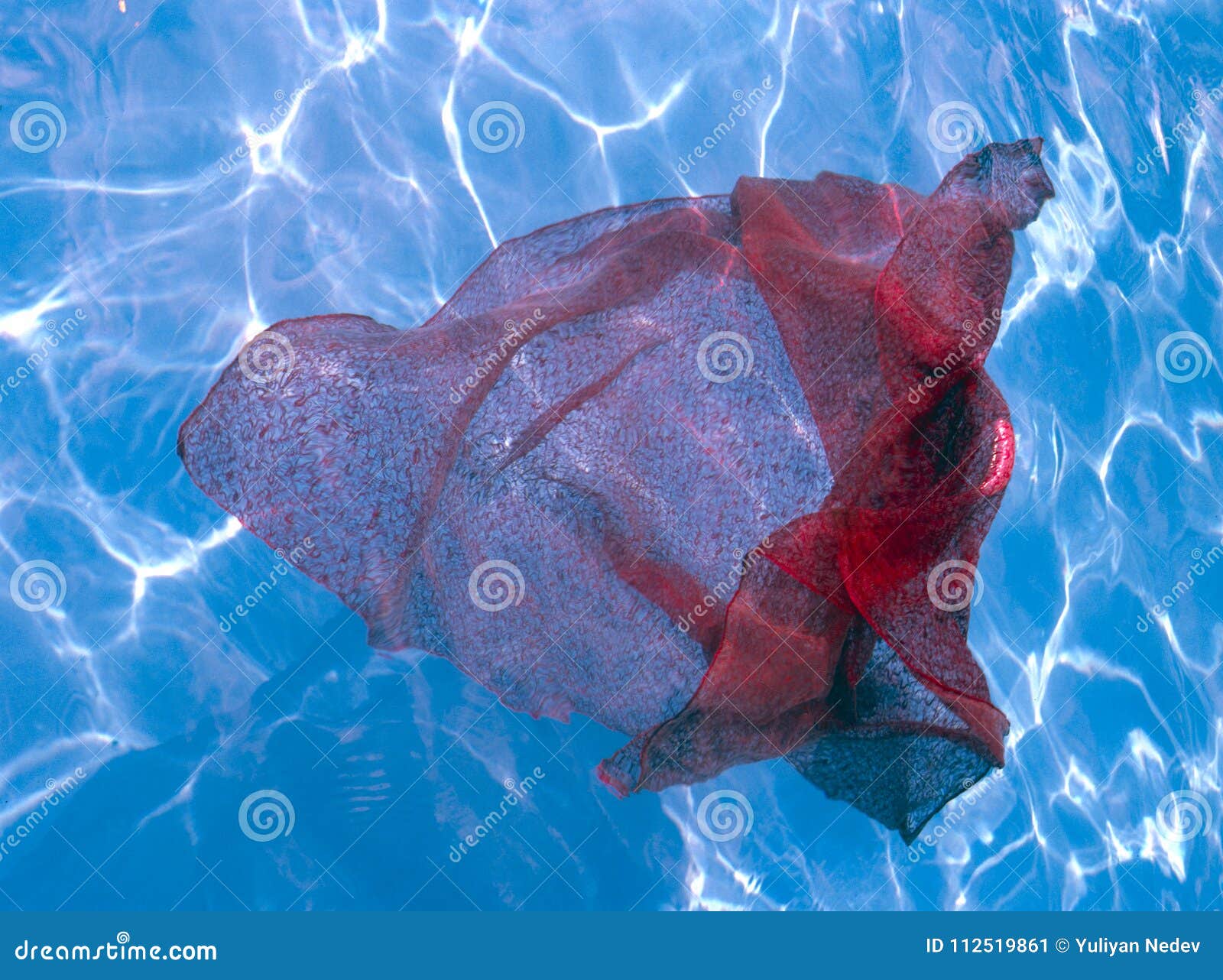 Red Fabric Floating in Pool Stock Image - Image of lookup, rainy: 112519861