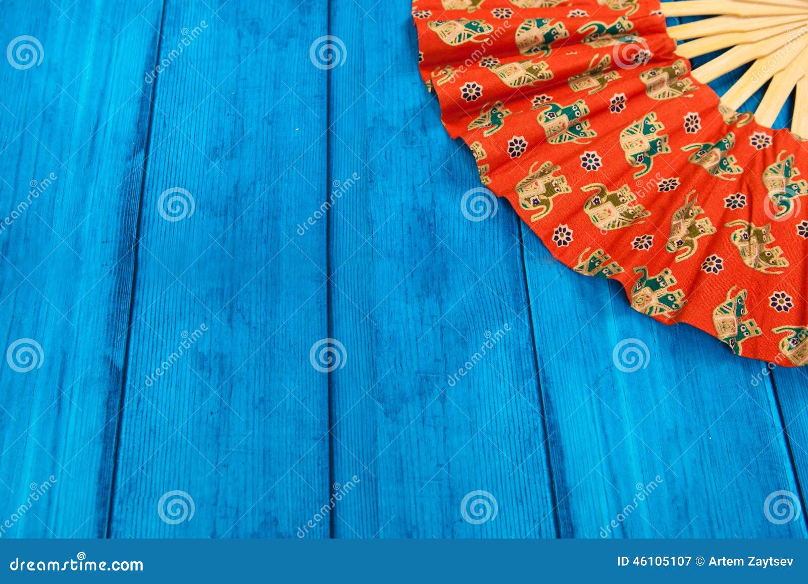 Red fan on blue wooden stock image. Image of elegance - 46105107