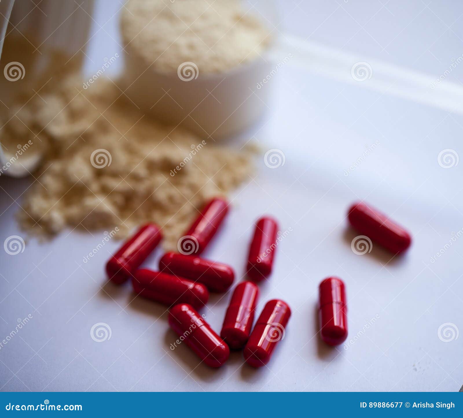 Red Fat Burner Capsules with Protein Powder in Background Stock Image ...