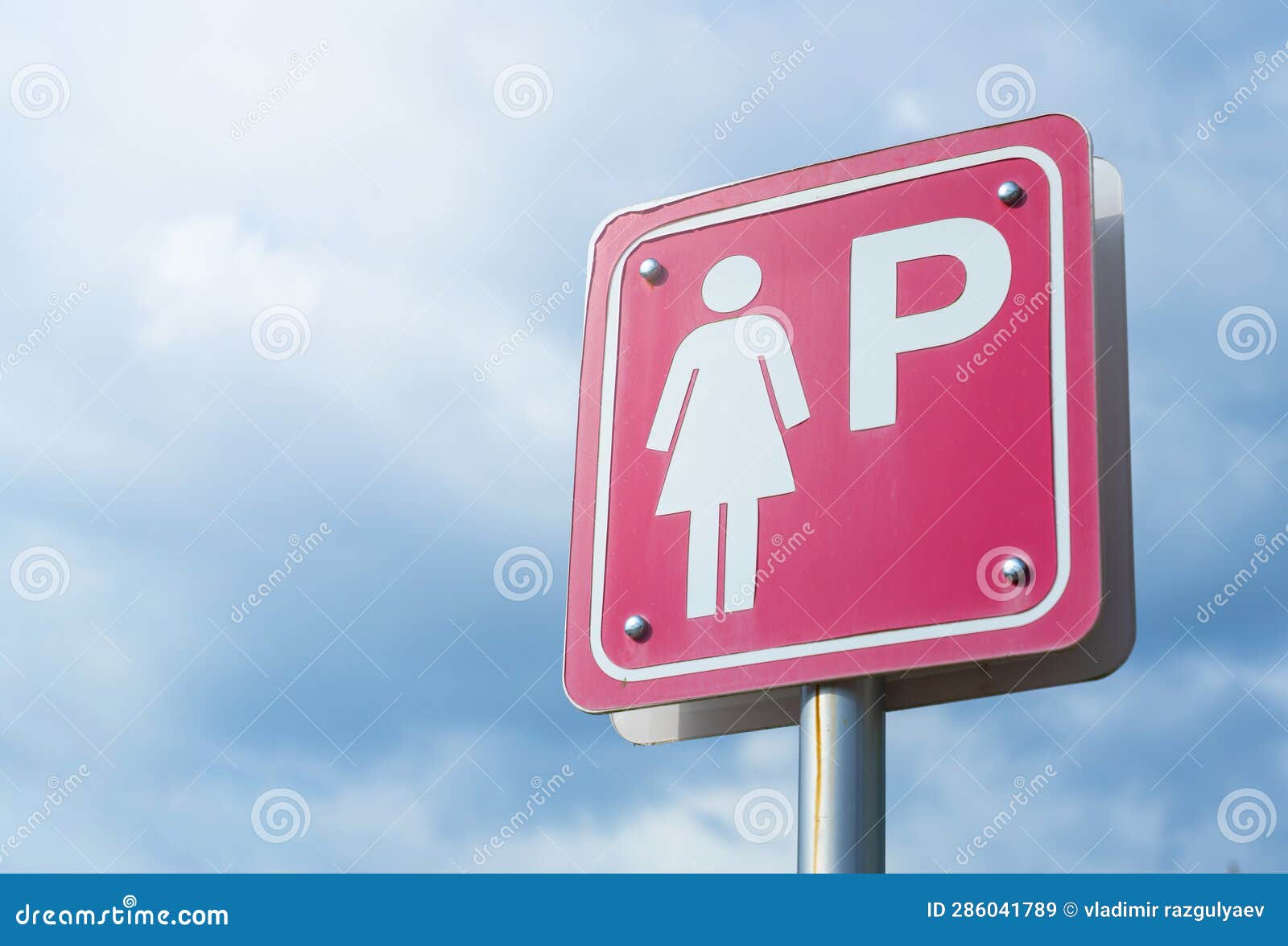 Red Female Parking Sign Against a Blue Sky. Stock Image - Image of sign ...