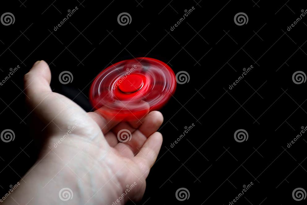 Red Fidget Spinner in Action Editorial Stock Image - Image of finger ...