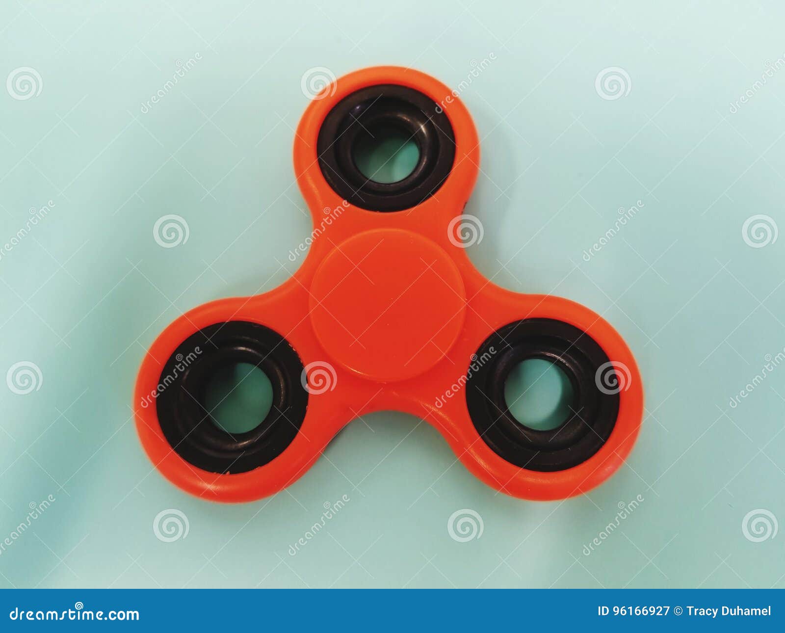 Red fidget spinner stock image. Image of fidget, shot - 96166927