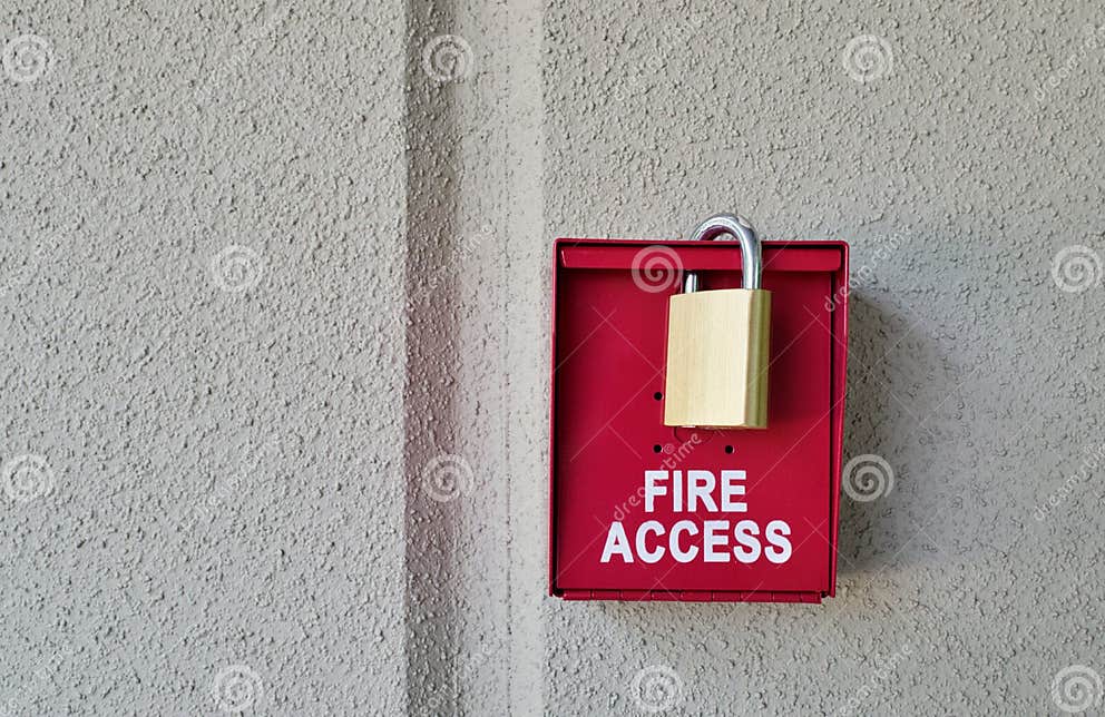 Red Fire Access Box with Padlock on a Plain Textured Wall. Stock Photo ...