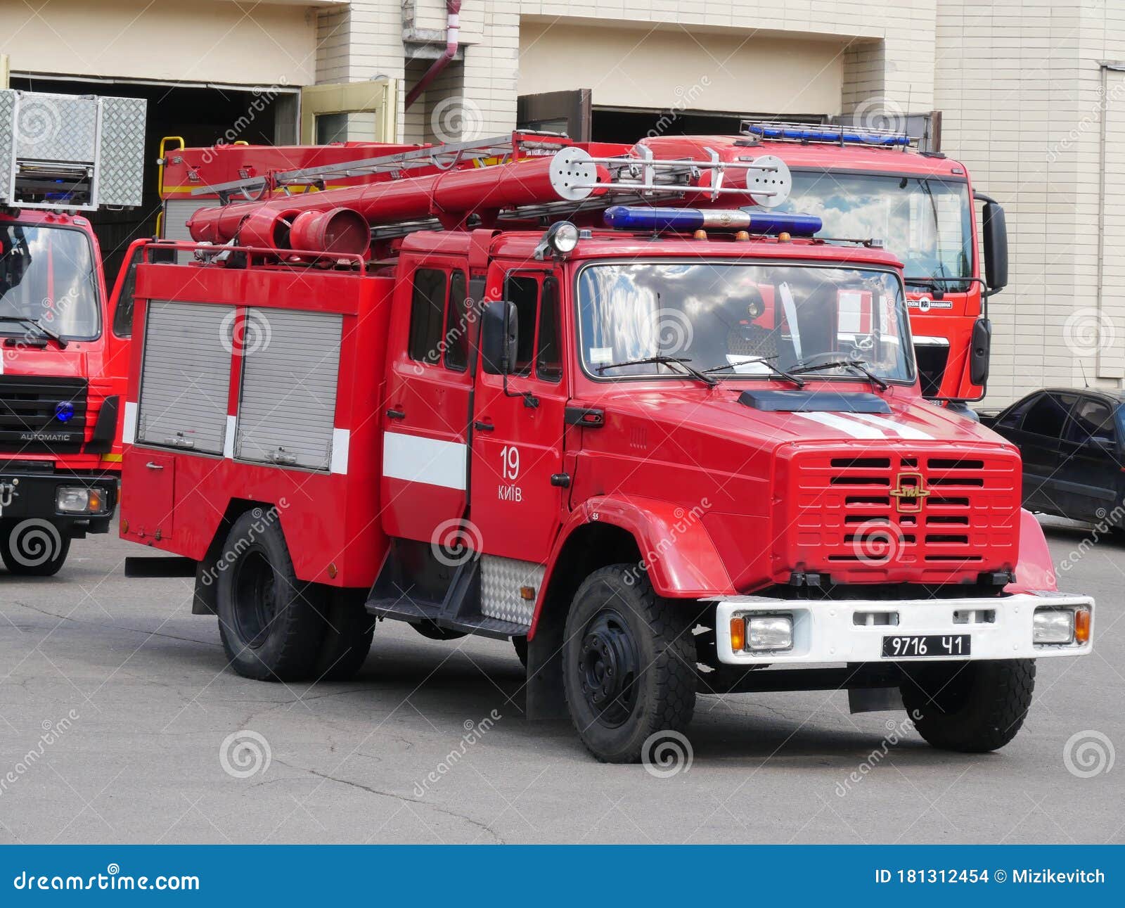 Red Fire Engines Standing at the Fire Station during the Day. Editorial ...