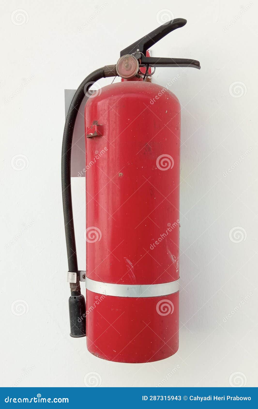 Red Fire Extinguisher Canister on White Wall Stock Image - Image of ...