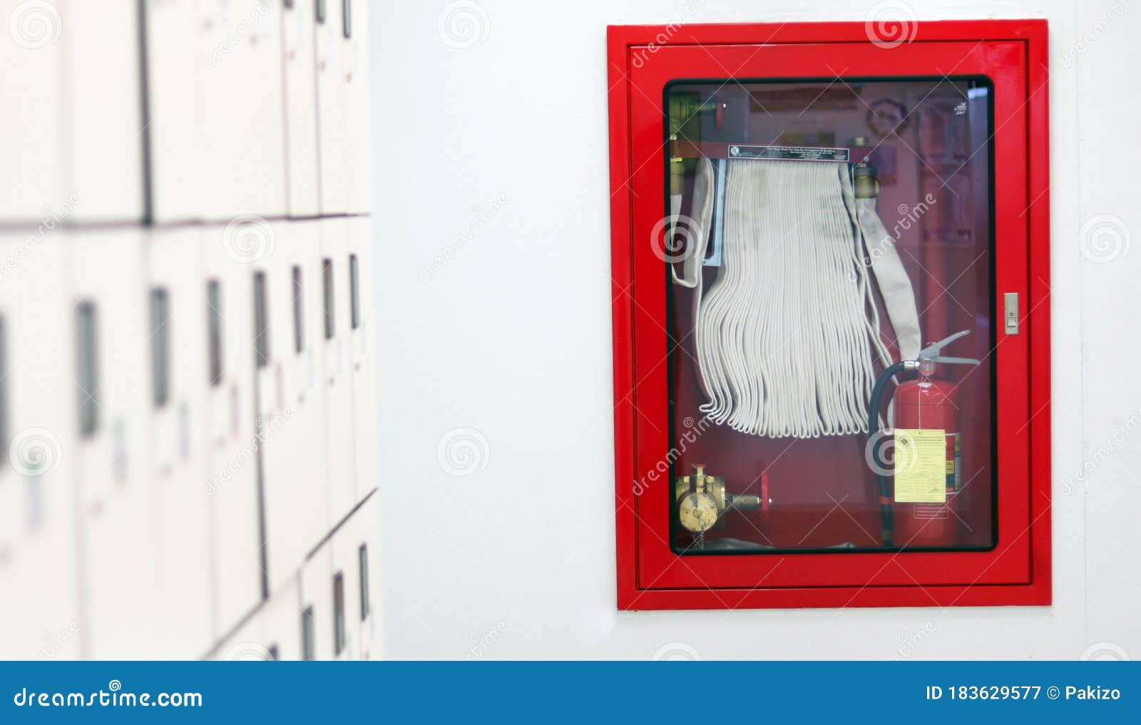 Red Fire Extinguisher and Fire Hose Reel Setting in Laboratory Walkway ...