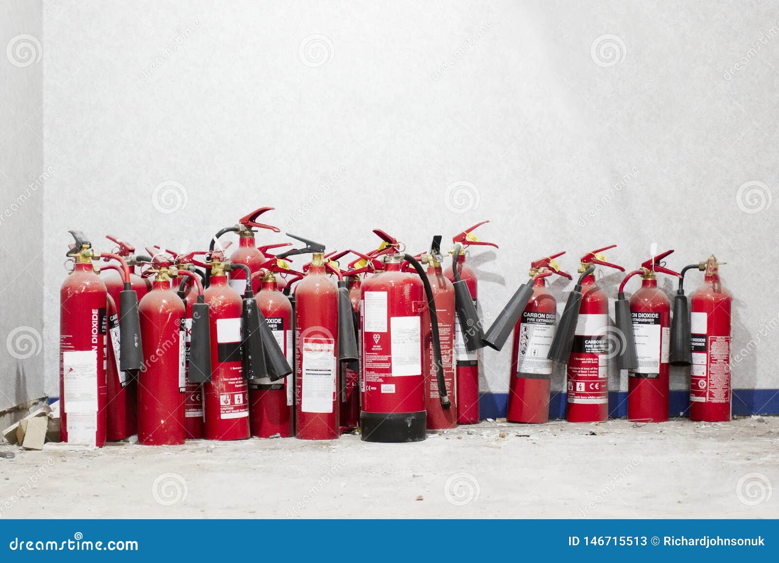 Red Fire Extinguishers in a Group in Construction Building Site Stock ...
