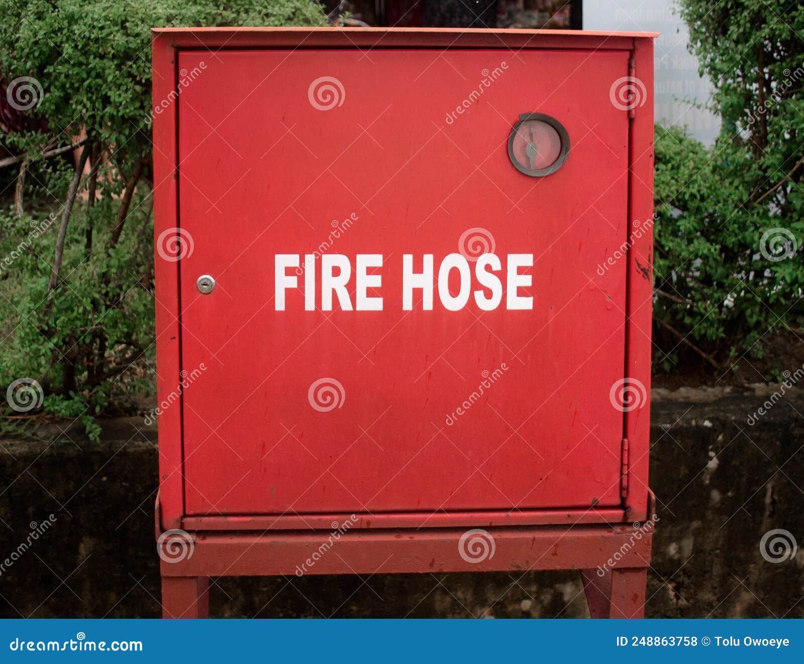 A Red Fire Hose is Available in Case of an Emergency. Stock Photo ...