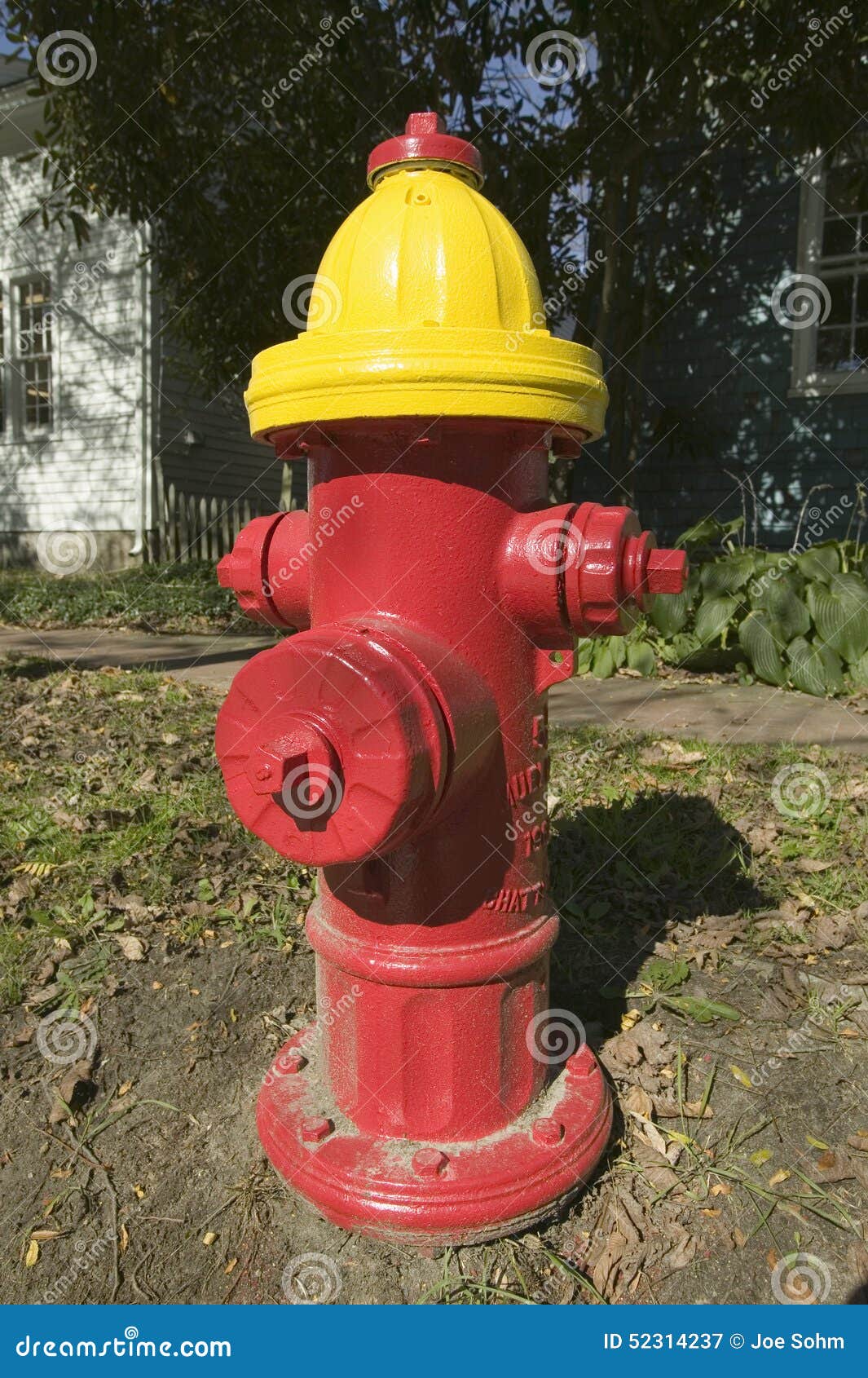 A Red Fire Hydrant with a Yellow Top is Seen Roadside in New England ...