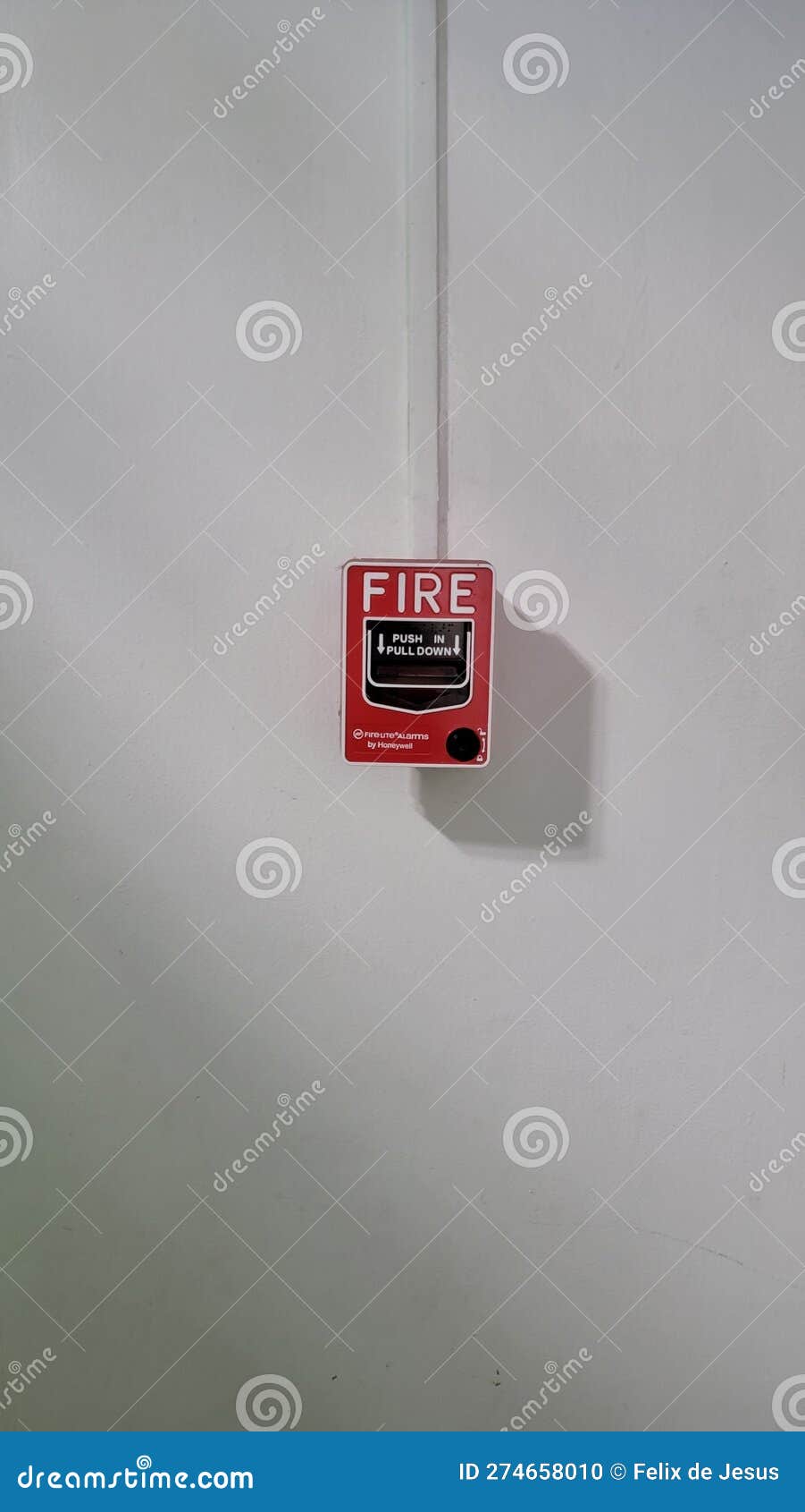 Red Fire Switch on the Wall Stock Photo - Image of label, black: 274658010