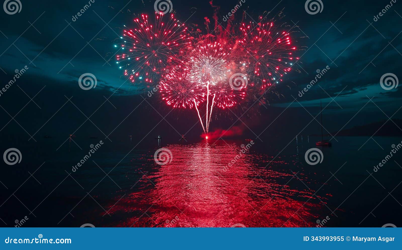 Red Fireworks Exploding in the Night Sky Over a Calm Water Reflection ...