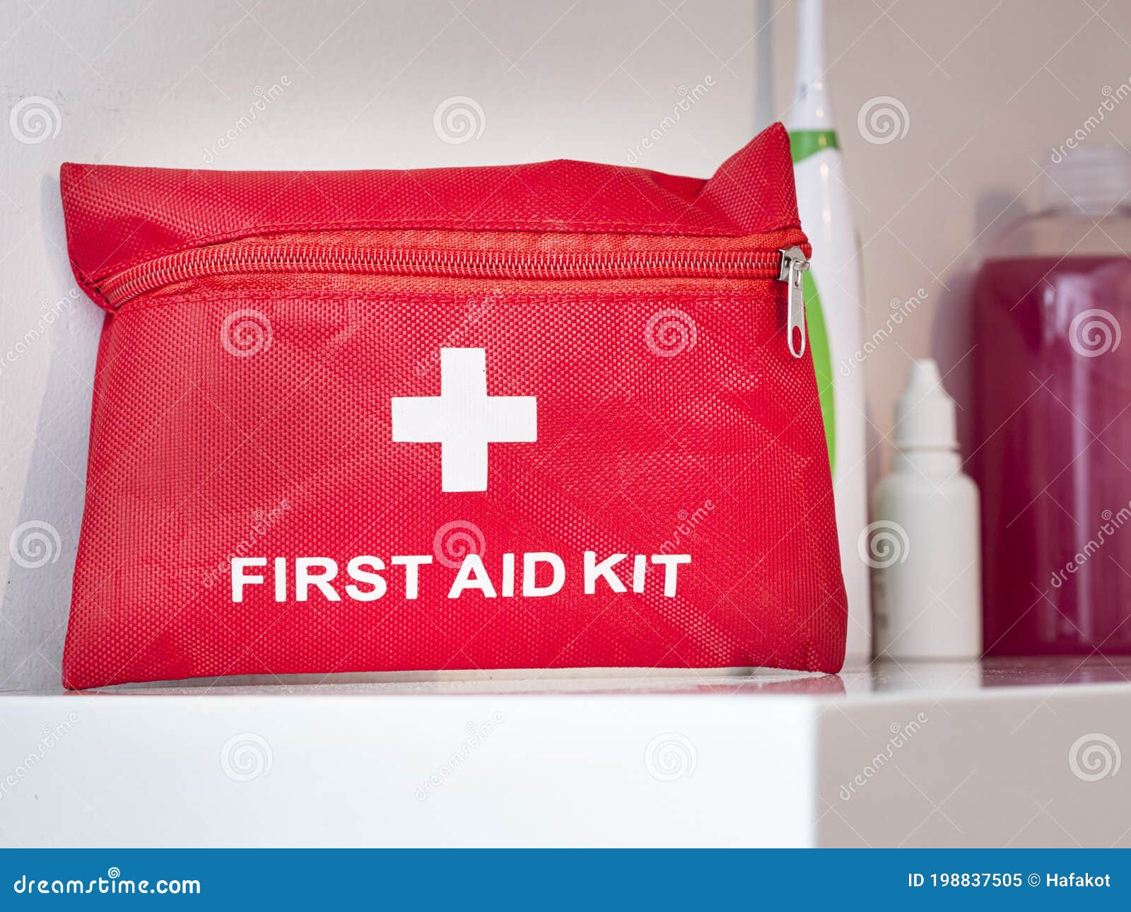 Red First Aid Kit Placed on the Shelf Stock Image - Image of healing ...