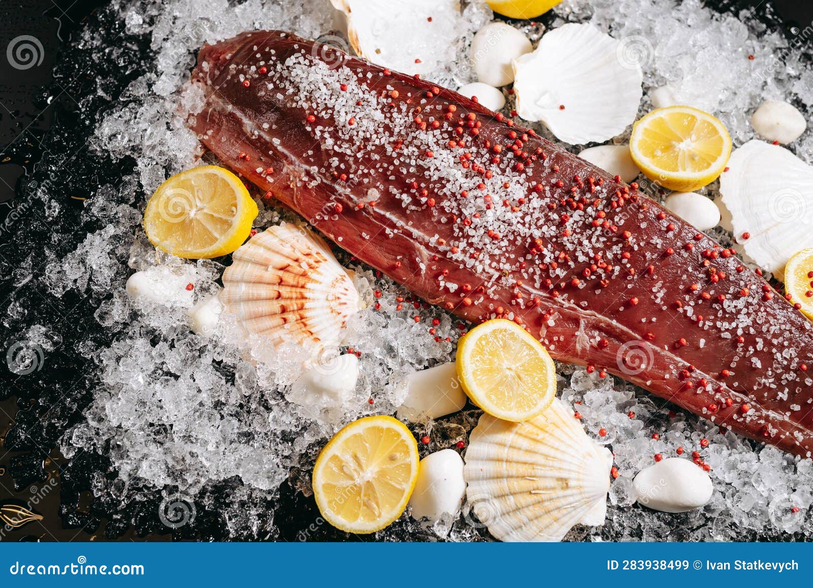 Red Fish Fillet Sprinkled with Salt and Spices with Lemon, Shells and ...